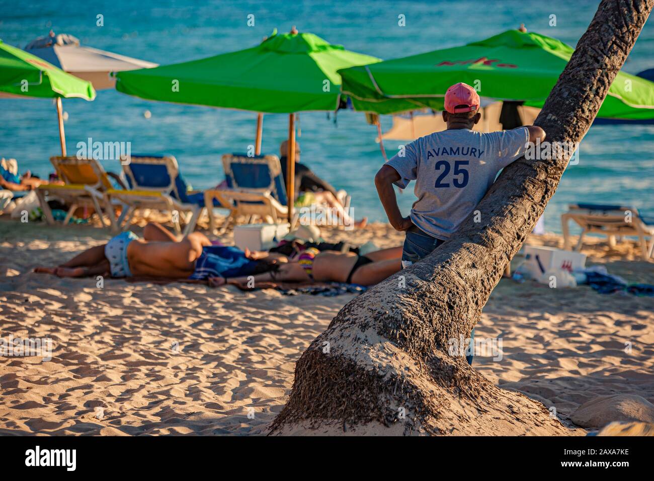 People on Dominicus Beach at sunset Stock Photo - Alamy