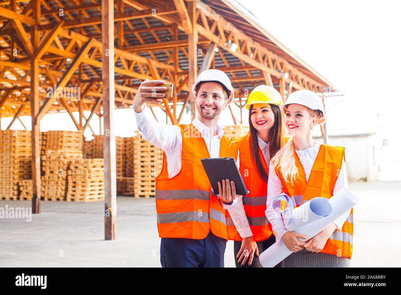 Smiling engineers construction workers hi-res stock photography and ...