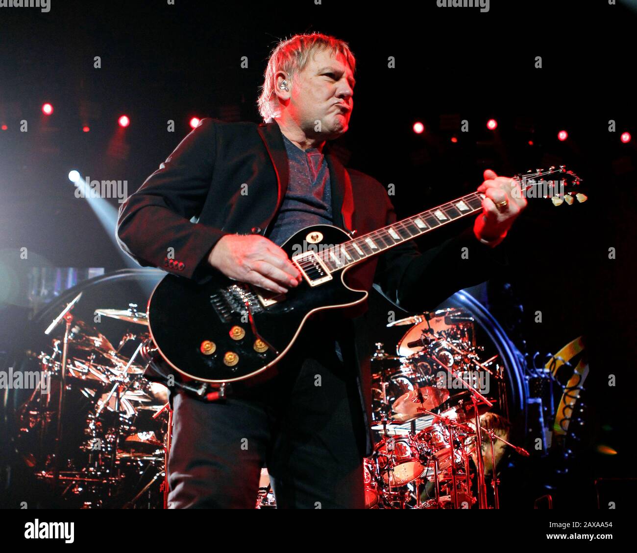 Rush guitarist Alex Lifeson performs with the rest of the band at the ...