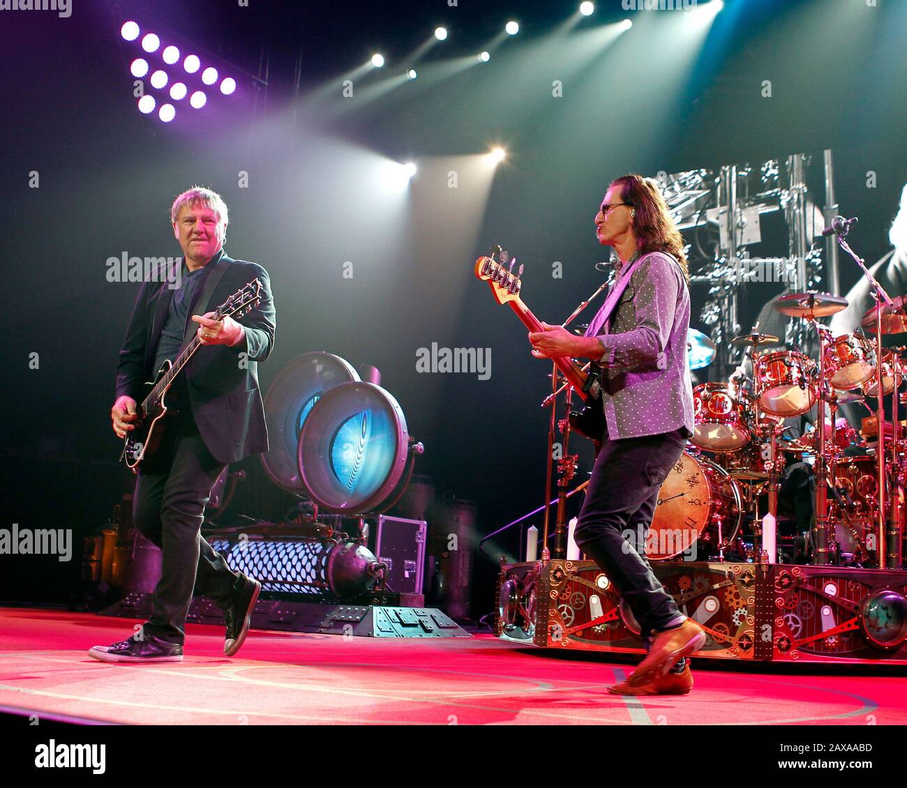 Rush guitarist Alex Lifeson and drummer Neil Peart perform with Geddy Lee at the BB&T Center in ...
