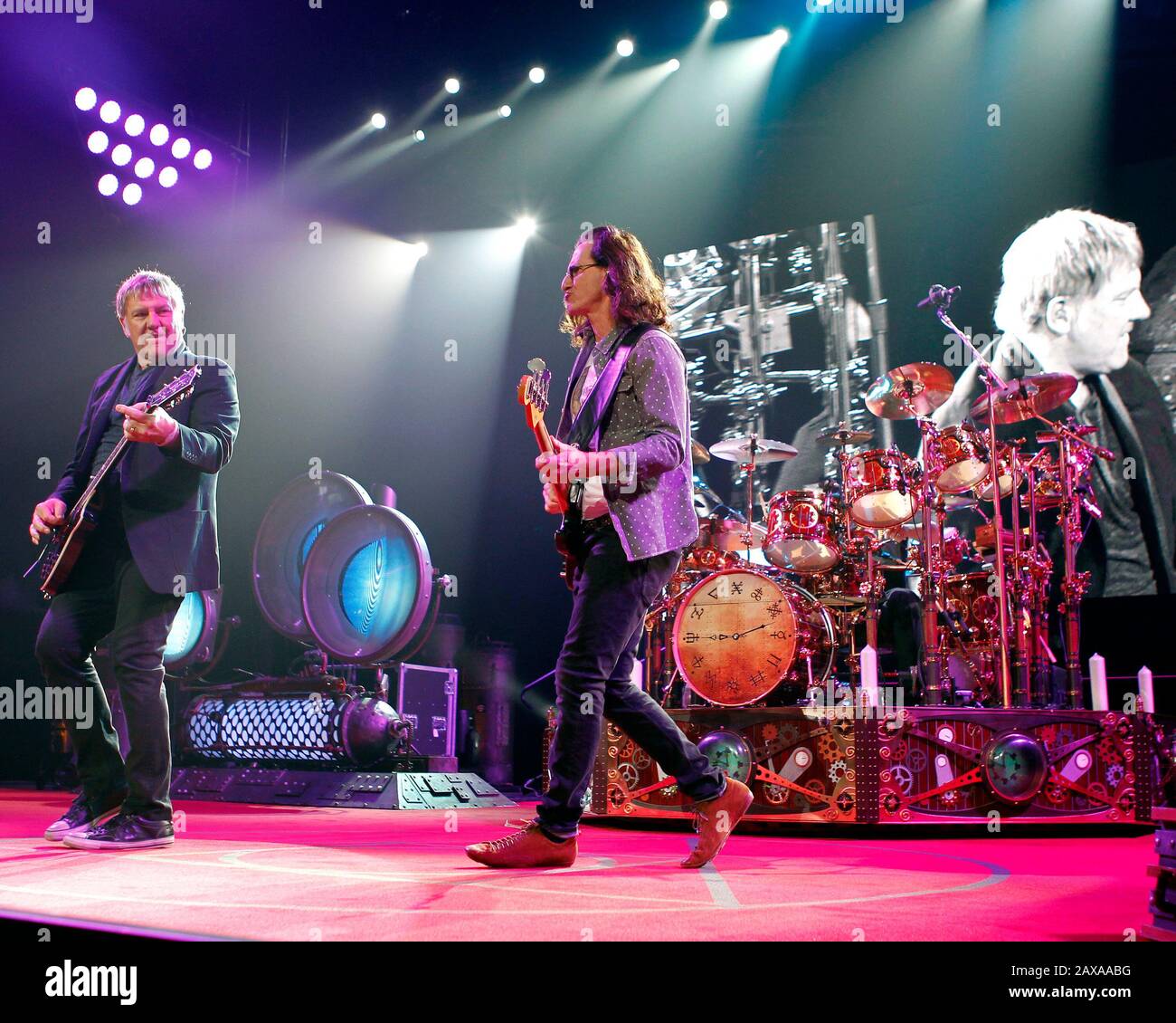 Rush guitarist Alex Lifeson and drummer Neil Peart perform with Geddy Lee at the BB&T Center in ...