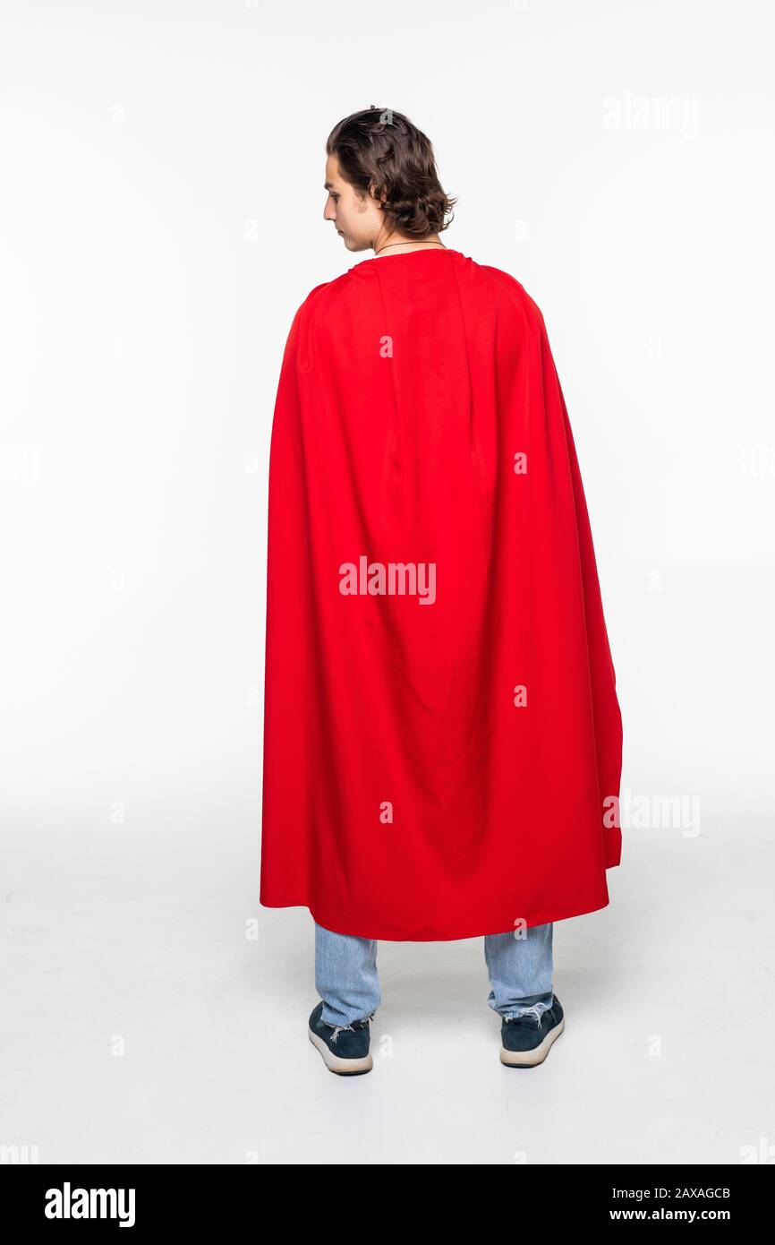 Portrait of man wearing bright super look outfit mantle isolated over ...