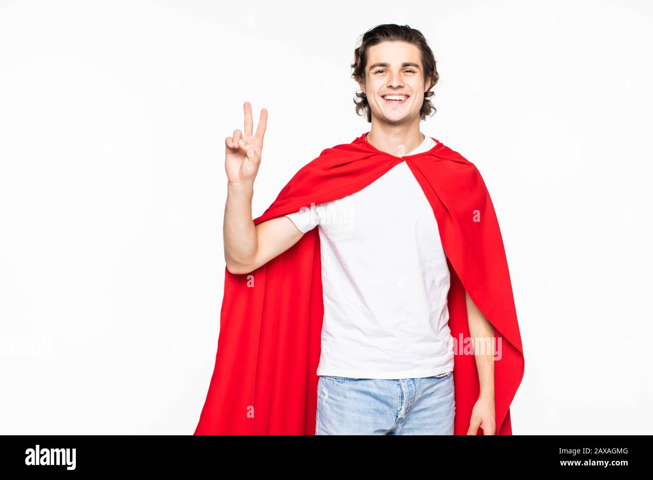 Portrait of man wearing bright super look outfit mantle isolated over ...