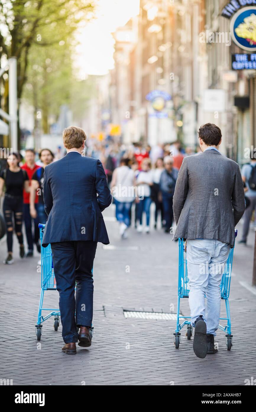 Students going grocery shopping, walking on the street with grocery ...
