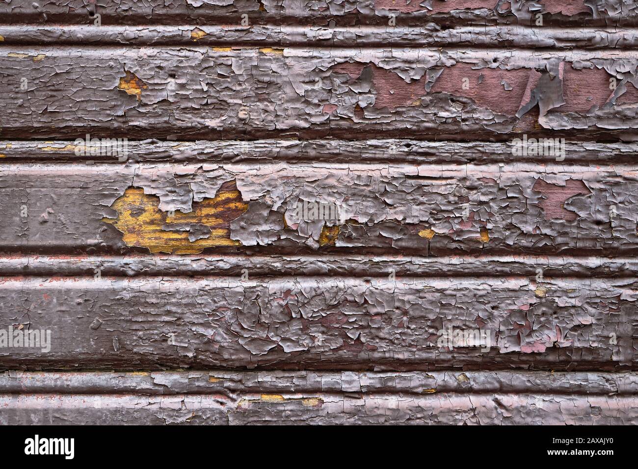 Old painted dilapidated flaky scaly wooden paint building wall brown ...
