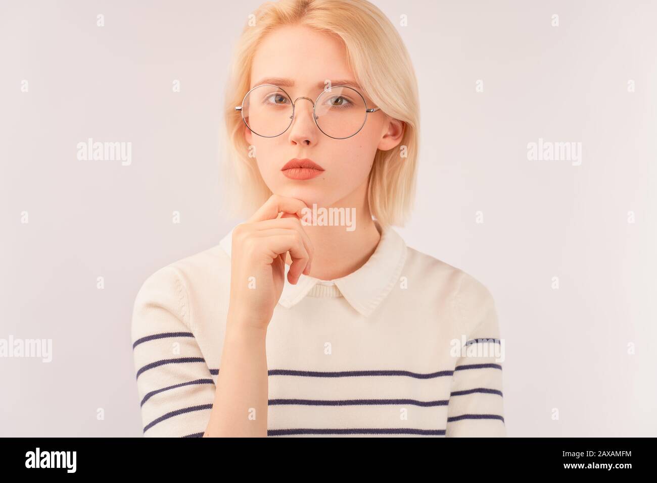girl has serious look at camera, has gentle smile Stock Photo - Alamy