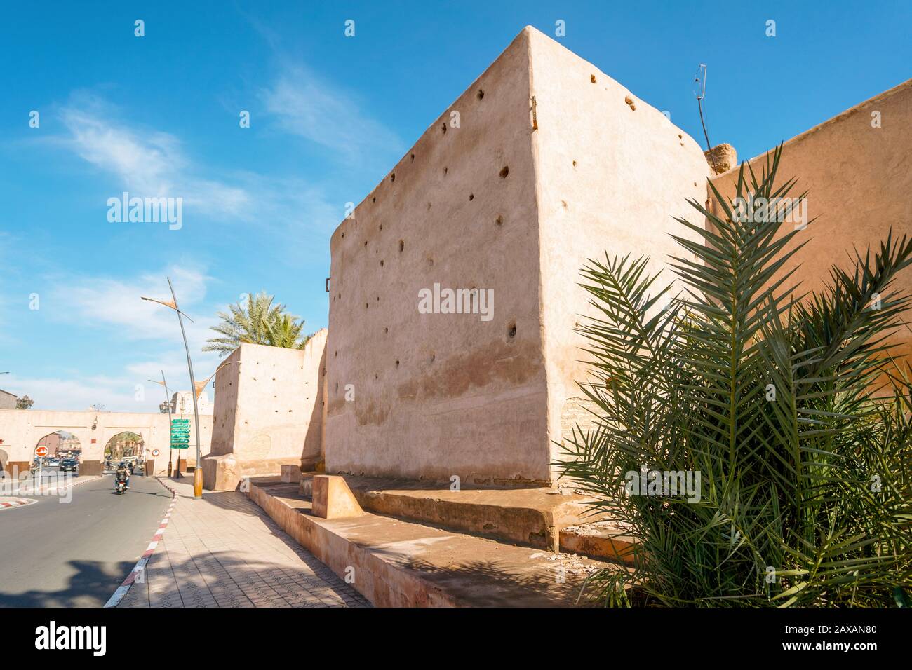 Old massive Marrakech city walls surrounding old town called medina ...