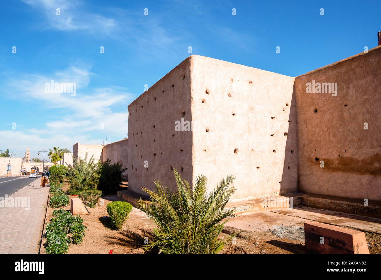 Old massive Marrakech city walls surrounding old town called medina ...