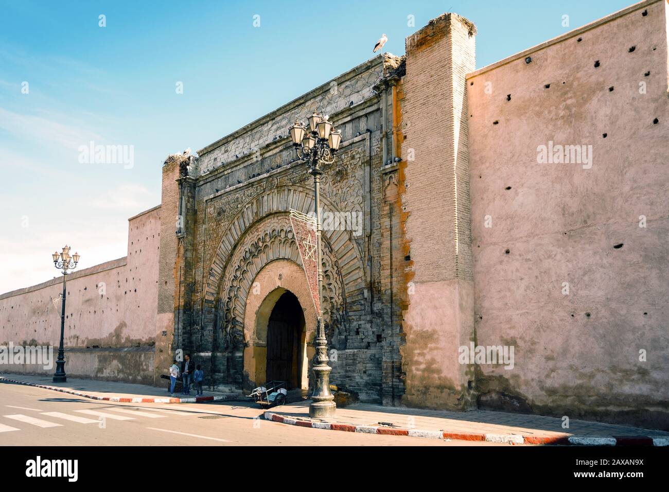 Massive gate in medieval city walls of Marrakech, Morocco Stock Photo ...