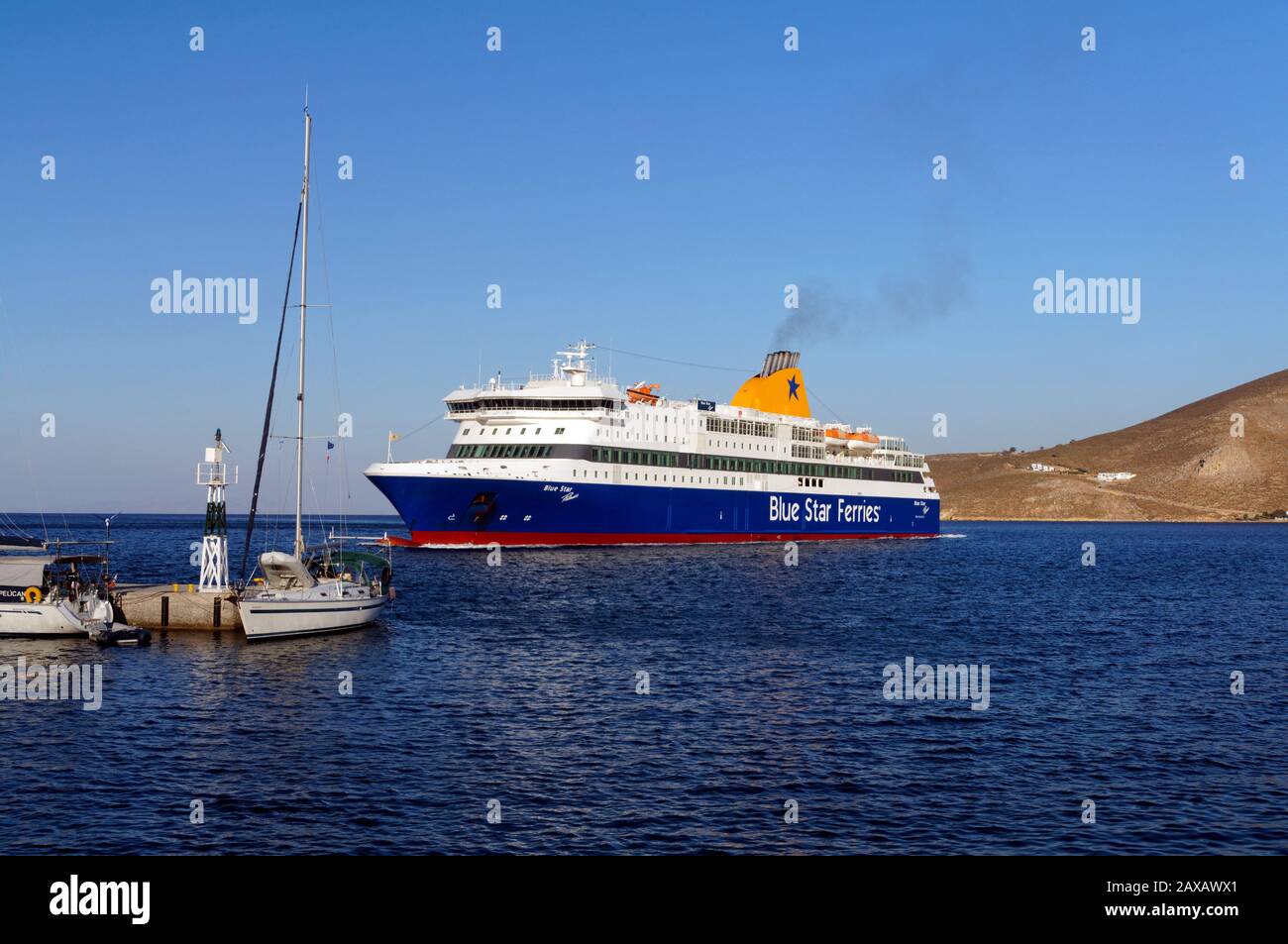 Blue Star Ferries ship The Patmos arriving at Livadia harbour, Tilos ...
