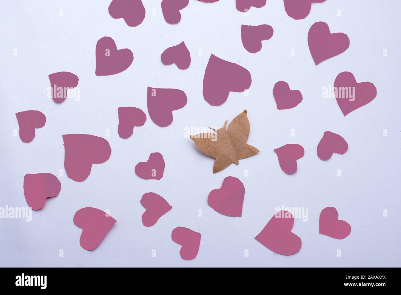 Paper butterfly and paper hearts in red color Stock Photo - Alamy