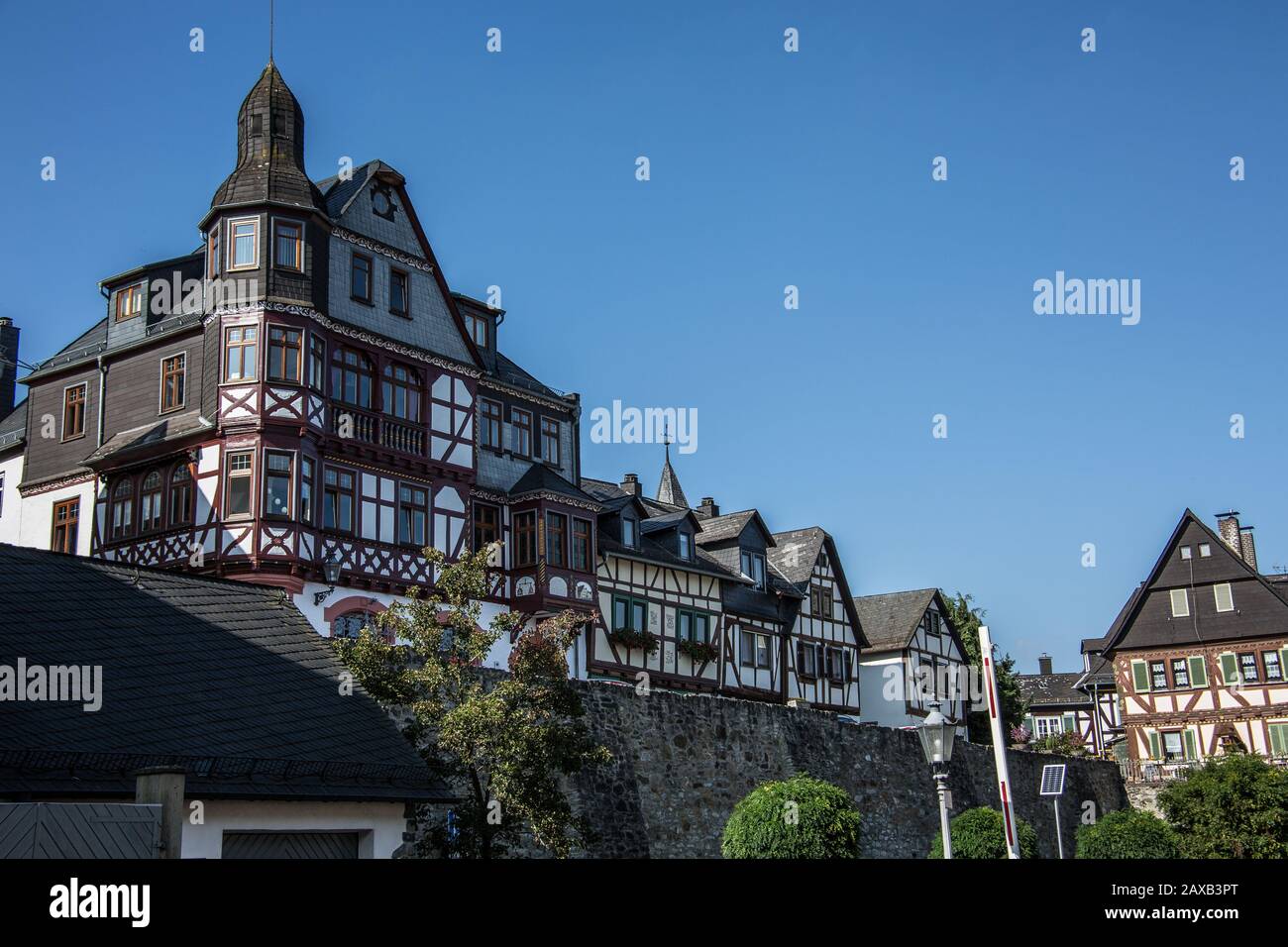 Half-timbered houses under the castle Stock Photo - Alamy