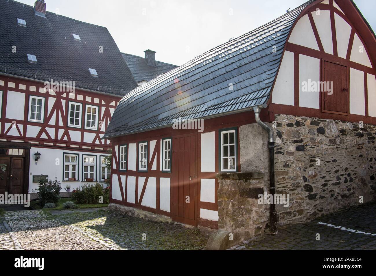 Half-timbered houses under the castle Stock Photo - Alamy