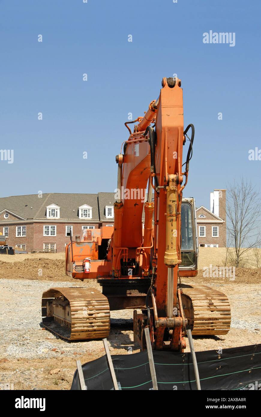 Excavator working on a New Housing Development Construction Site Stock ...