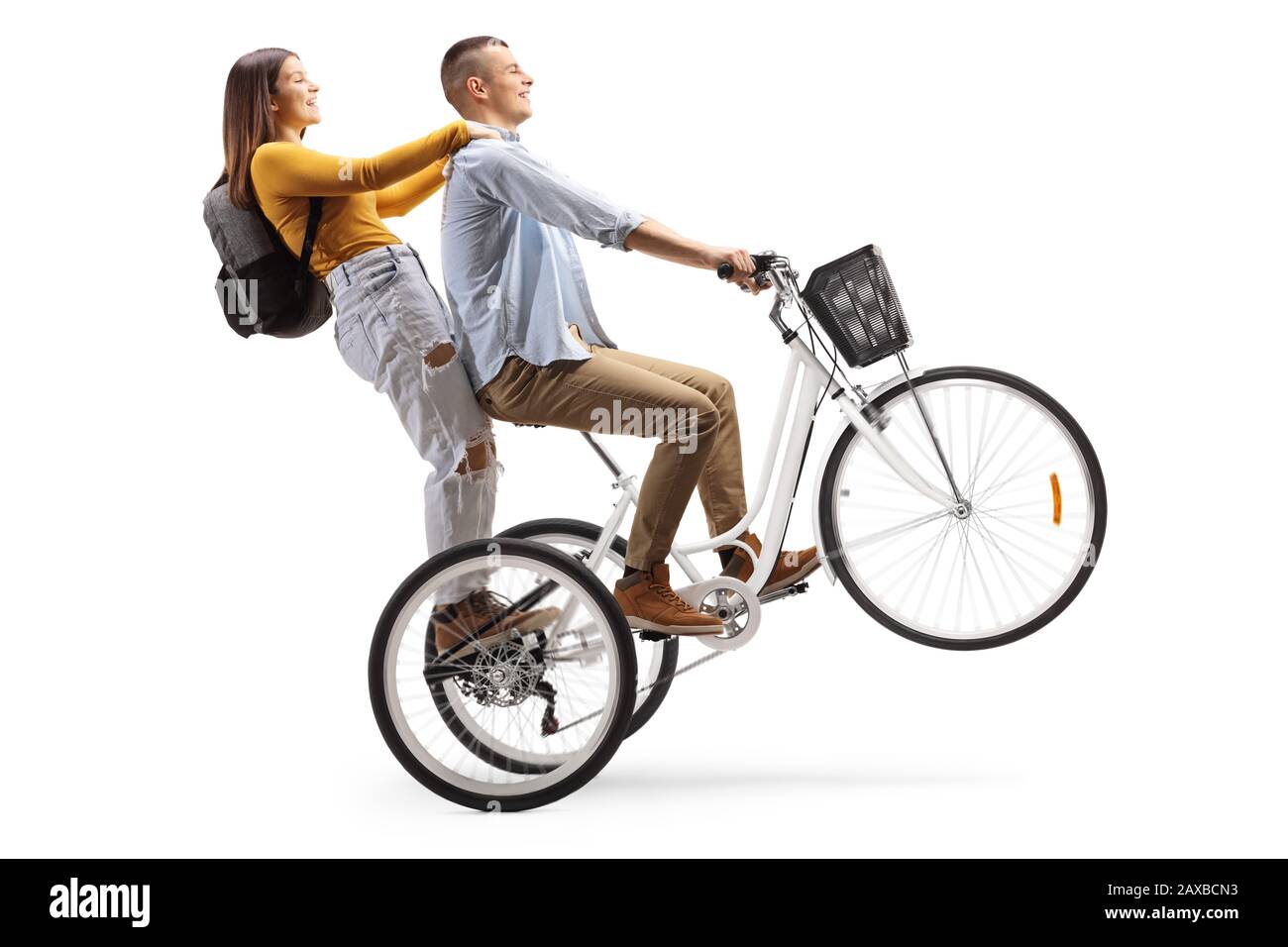 Young man riding a female student on a tricycle isolated on white ...