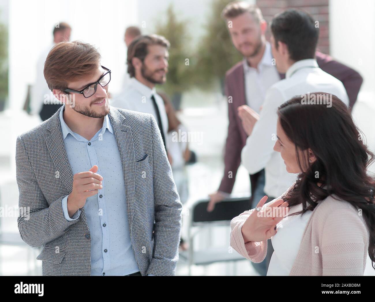close up. smiling young employees standing together Stock Photo - Alamy