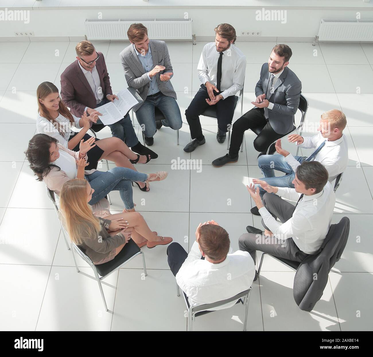 young employees ask questions during business training Stock Photo - Alamy