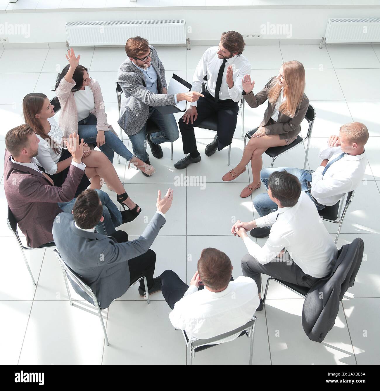 young employees ask questions during business training Stock Photo - Alamy