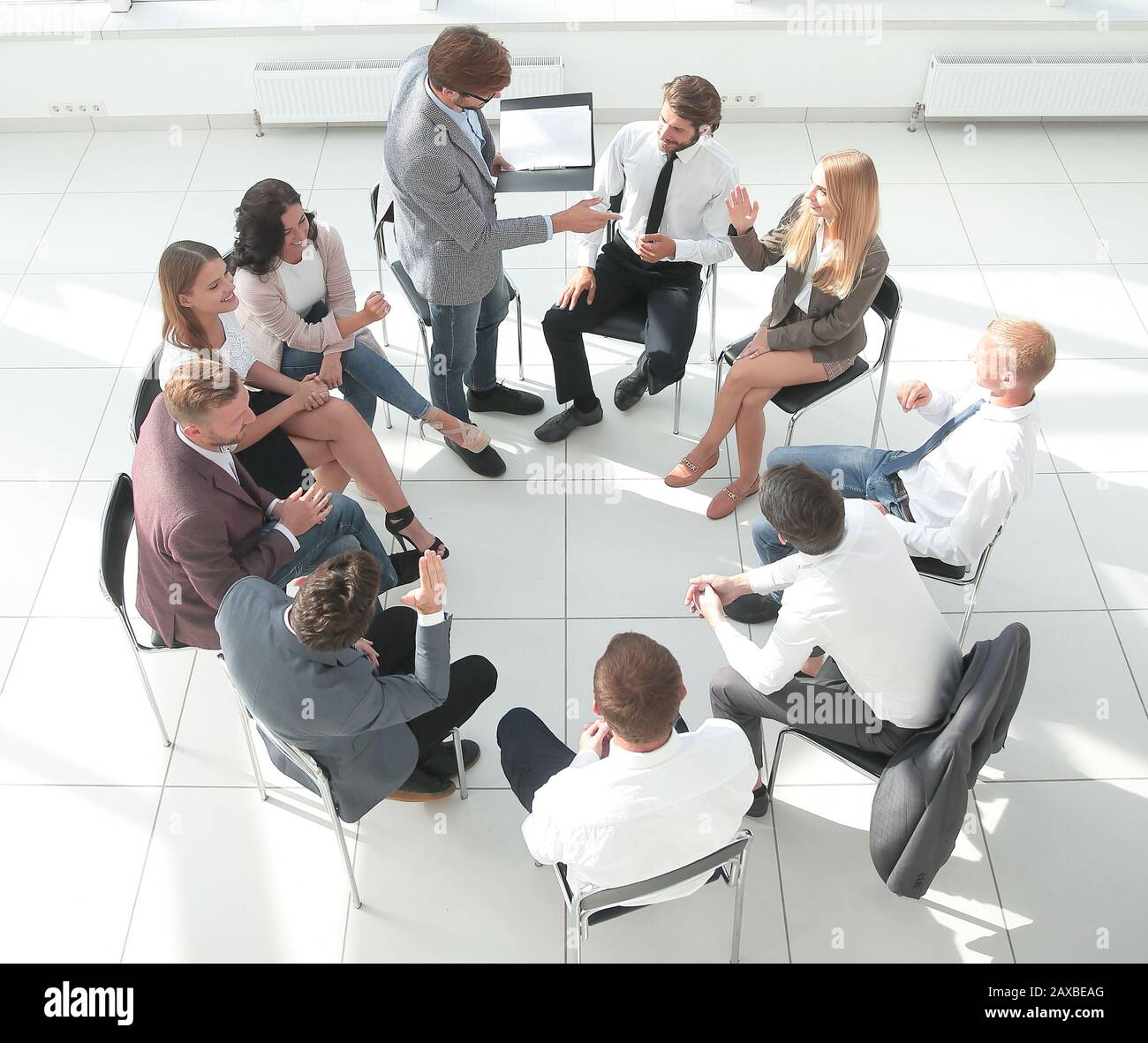 young employees ask questions during business training Stock Photo - Alamy
