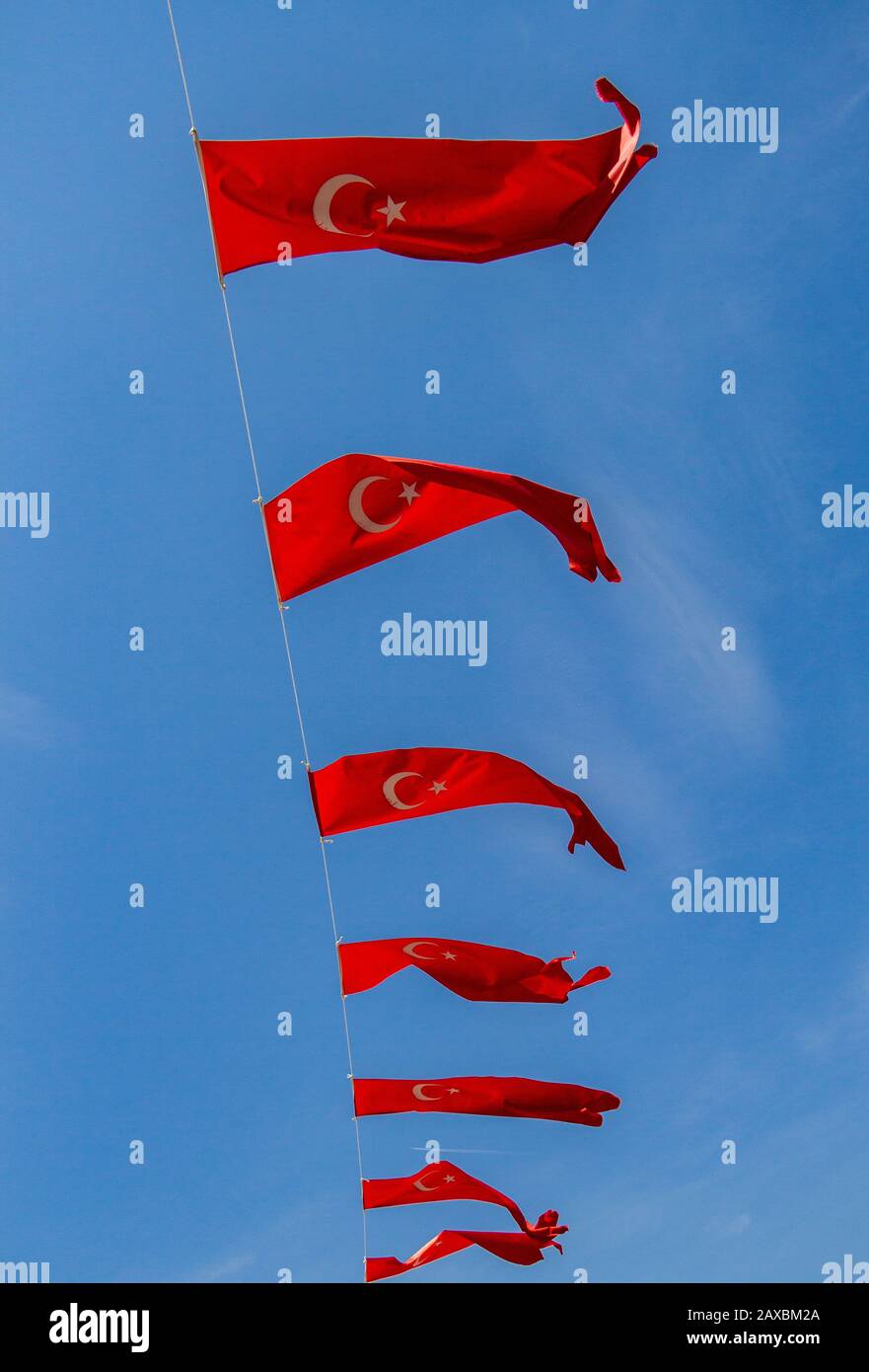 Turkish national flags with white star and moon in sky Stock Photo - Alamy
