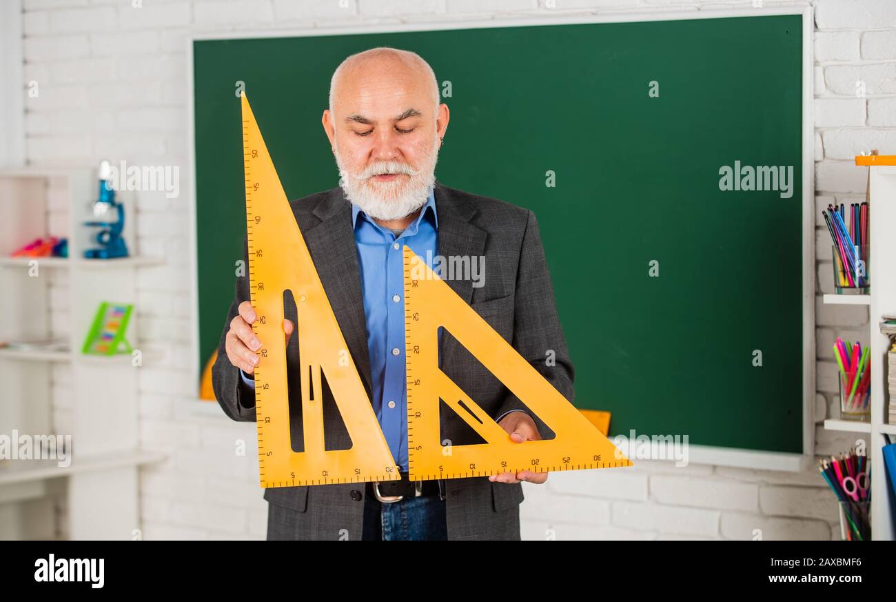 Maths exam. Mathematics at chalkboard. senior man teacher use math ...