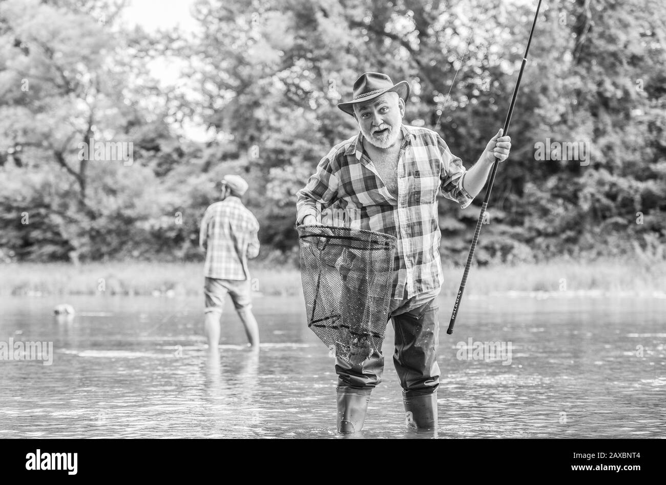 Fisherman with fishing rod. Activity and hobby. Fishing freshwater lake ...