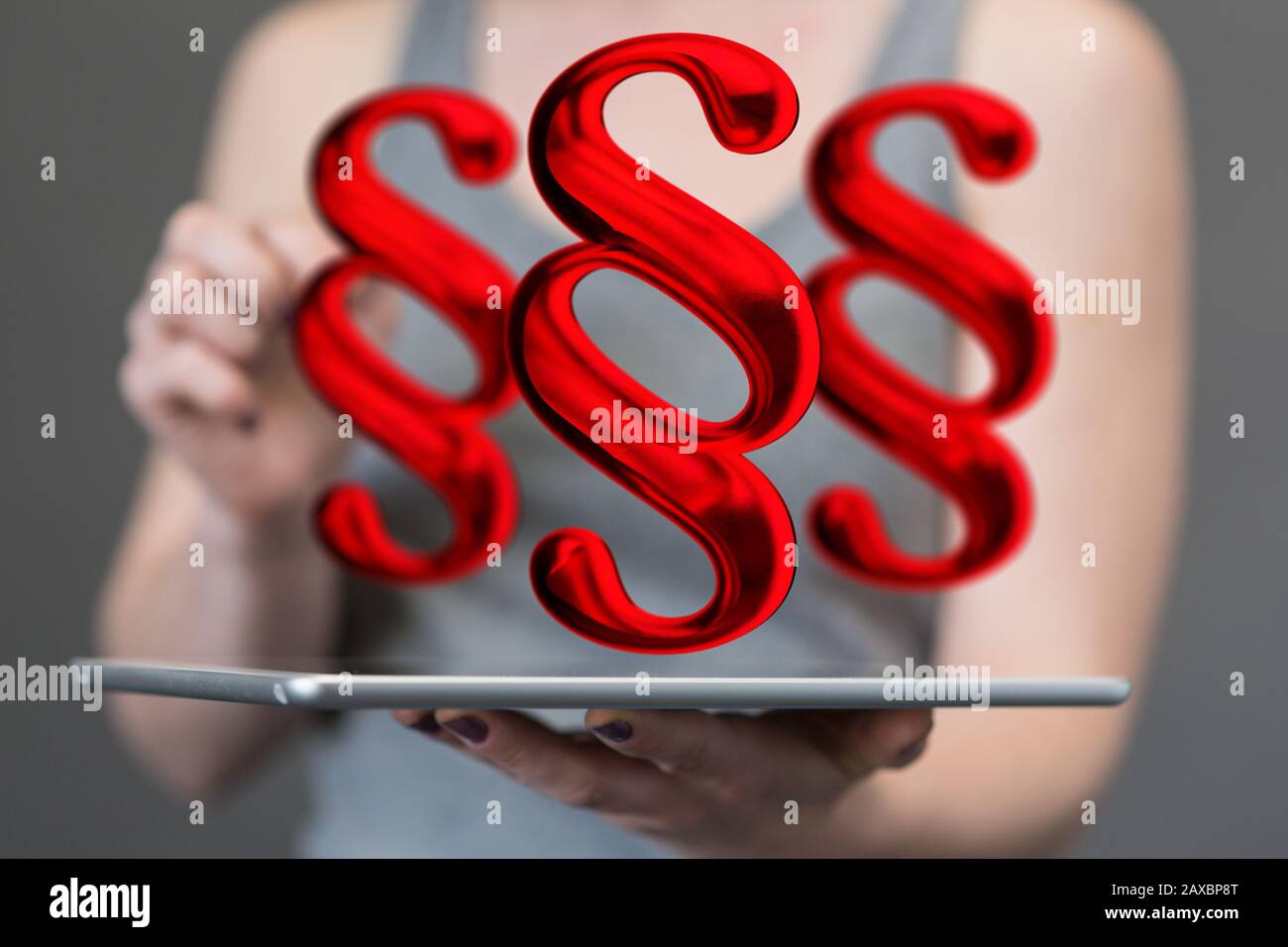 Person working with digital paragraph law symbols Stock Photo - Alamy