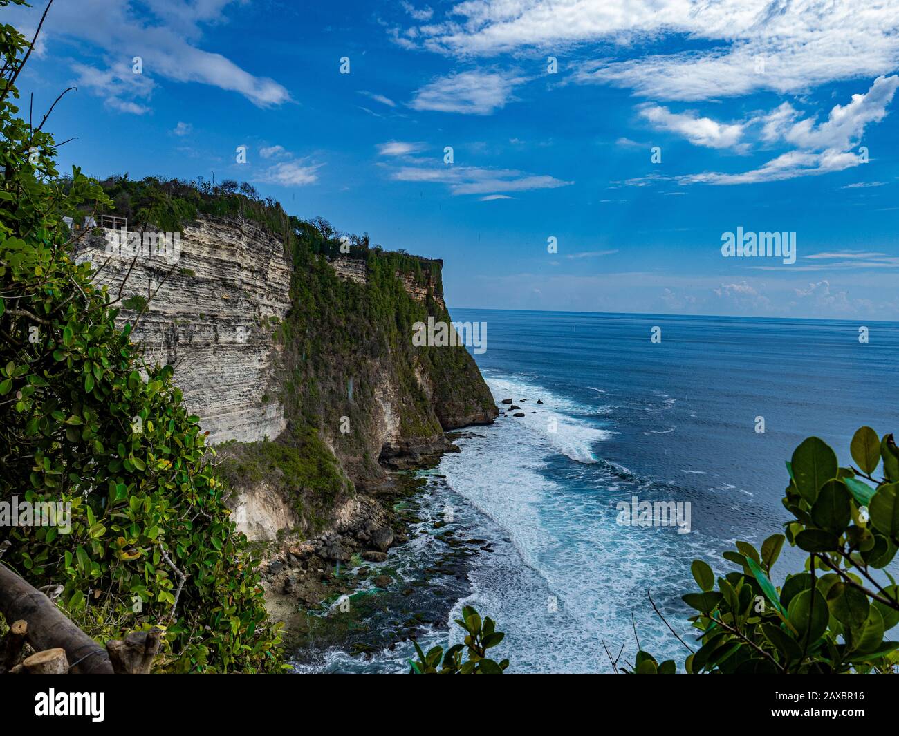 Uluwatu Temple cliff view at the coastline on Bali Indonesia with blue ...