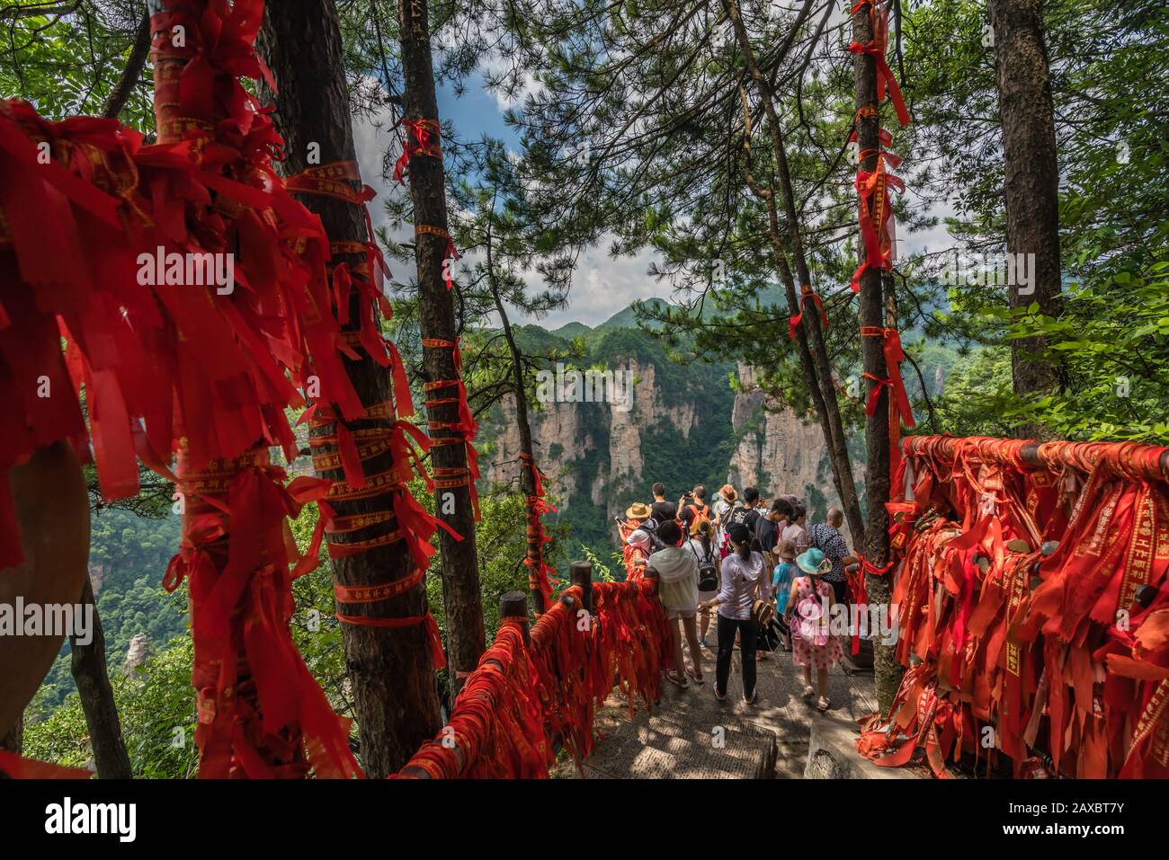 Zhangjiajie, China - August 2019 : Red ribbons tied to the barriers ...