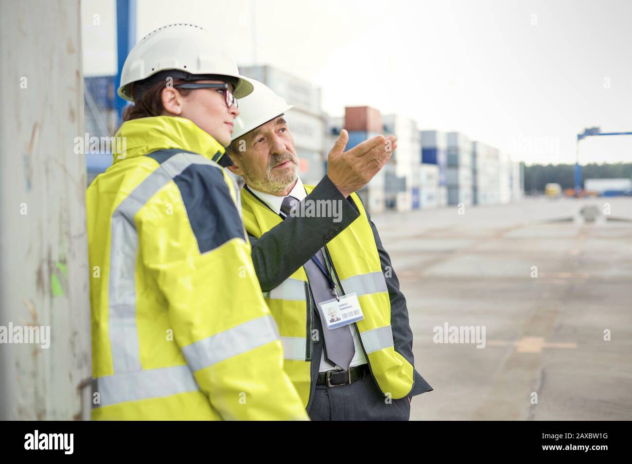 Dock manager and worker talking at shipyard Stock Photo - Alamy