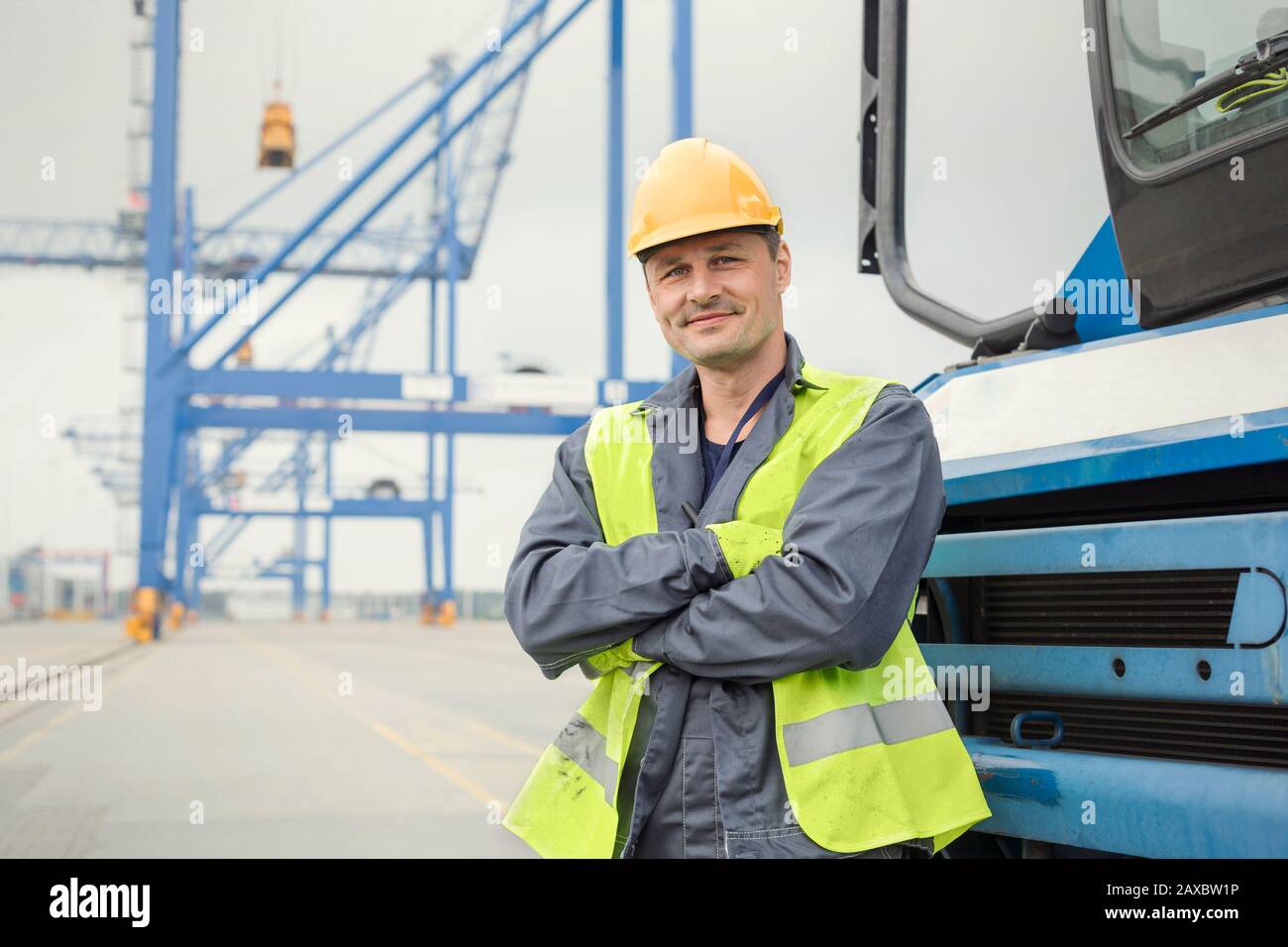 Portrait confident dock worker at shipyard Stock Photo - Alamy