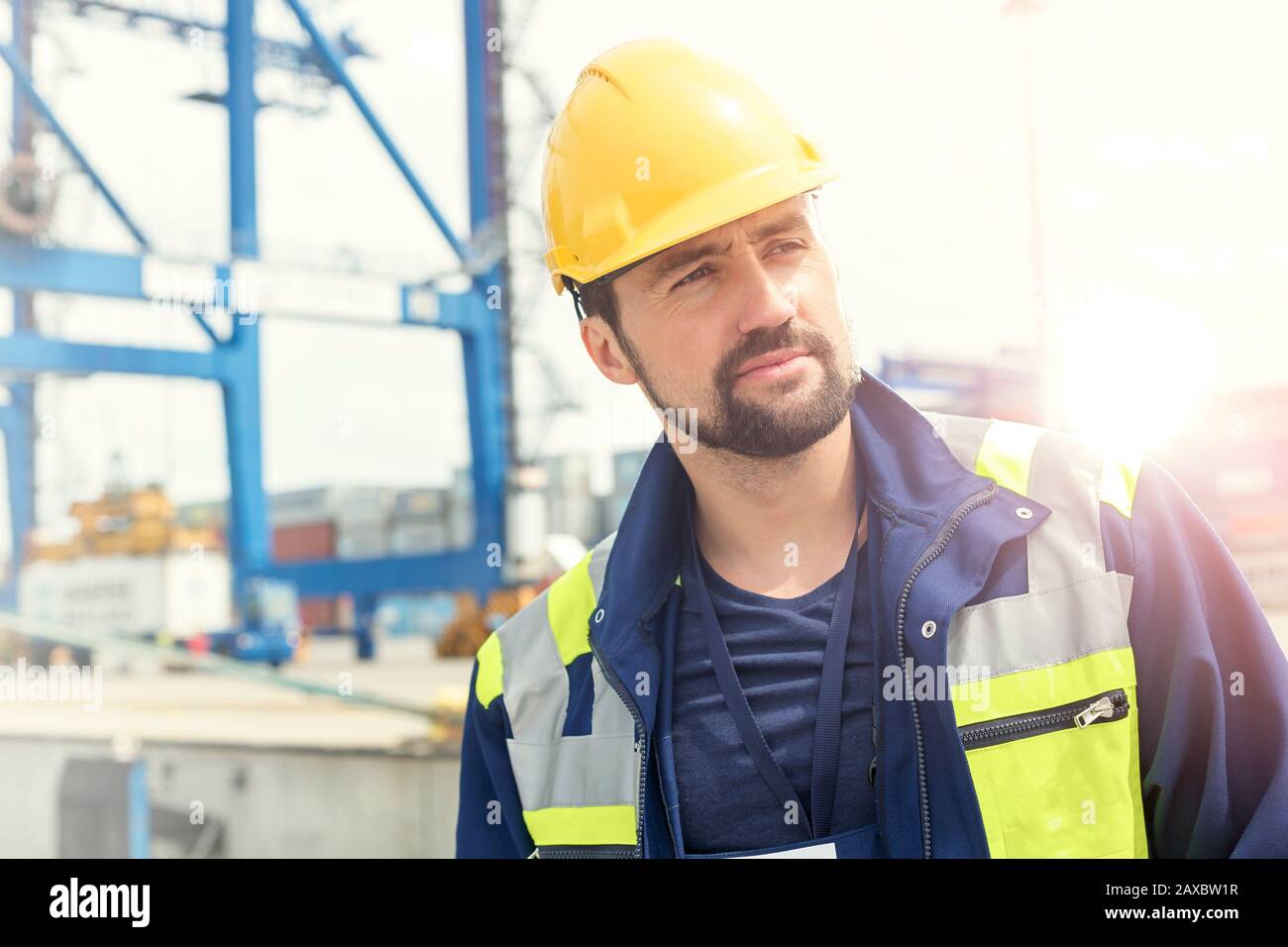 Confident dock worker at shipyard Stock Photo - Alamy