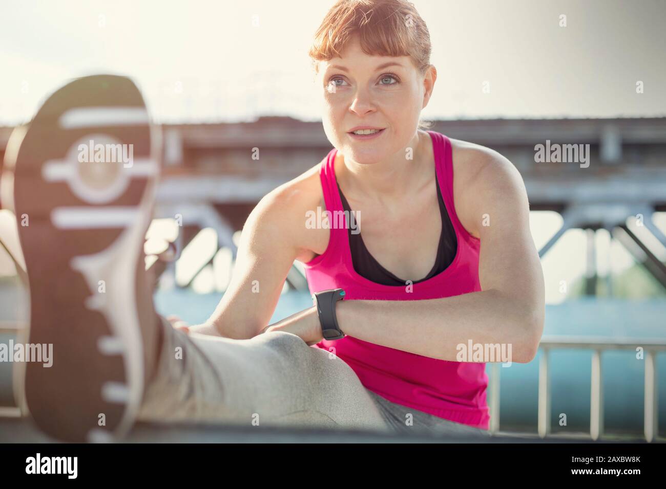 Female runner stretching hi-res stock photography and images - Alamy