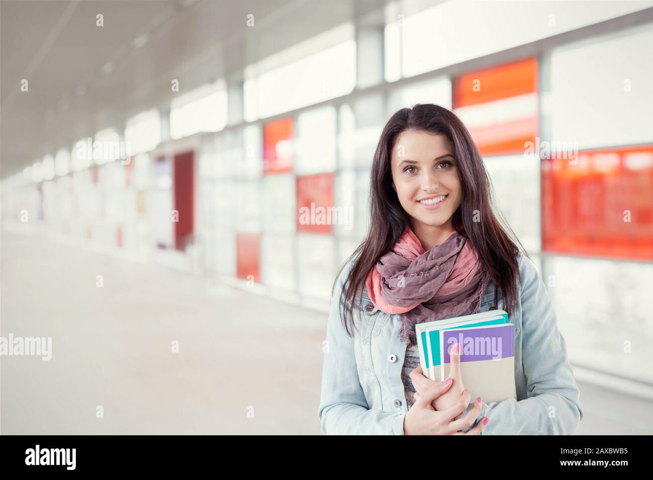Woman corridor books hi-res stock photography and images - Alamy