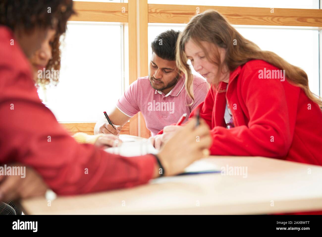 Focused college students studying in classroom Stock Photo - Alamy