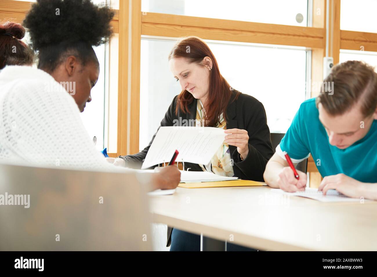 Dedicated college students studying in classroom Stock Photo - Alamy