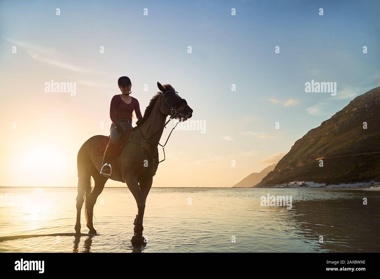 Woman riding horse beach sunset hi-res stock photography and images - Alamy