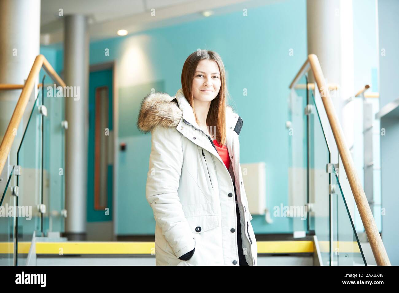 Portrait confident young female college student wearing coat Stock ...