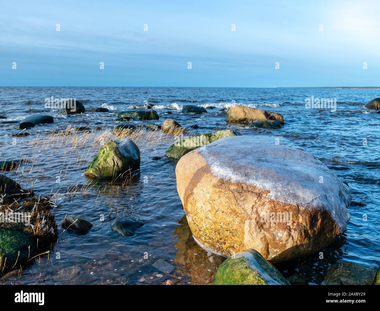 landscape with stony beach, stones of various shapes in the sea Stock ...