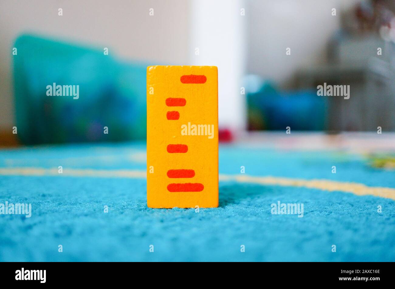 Rectangular toy for children put on a multicolored surface Stock Photo ...
