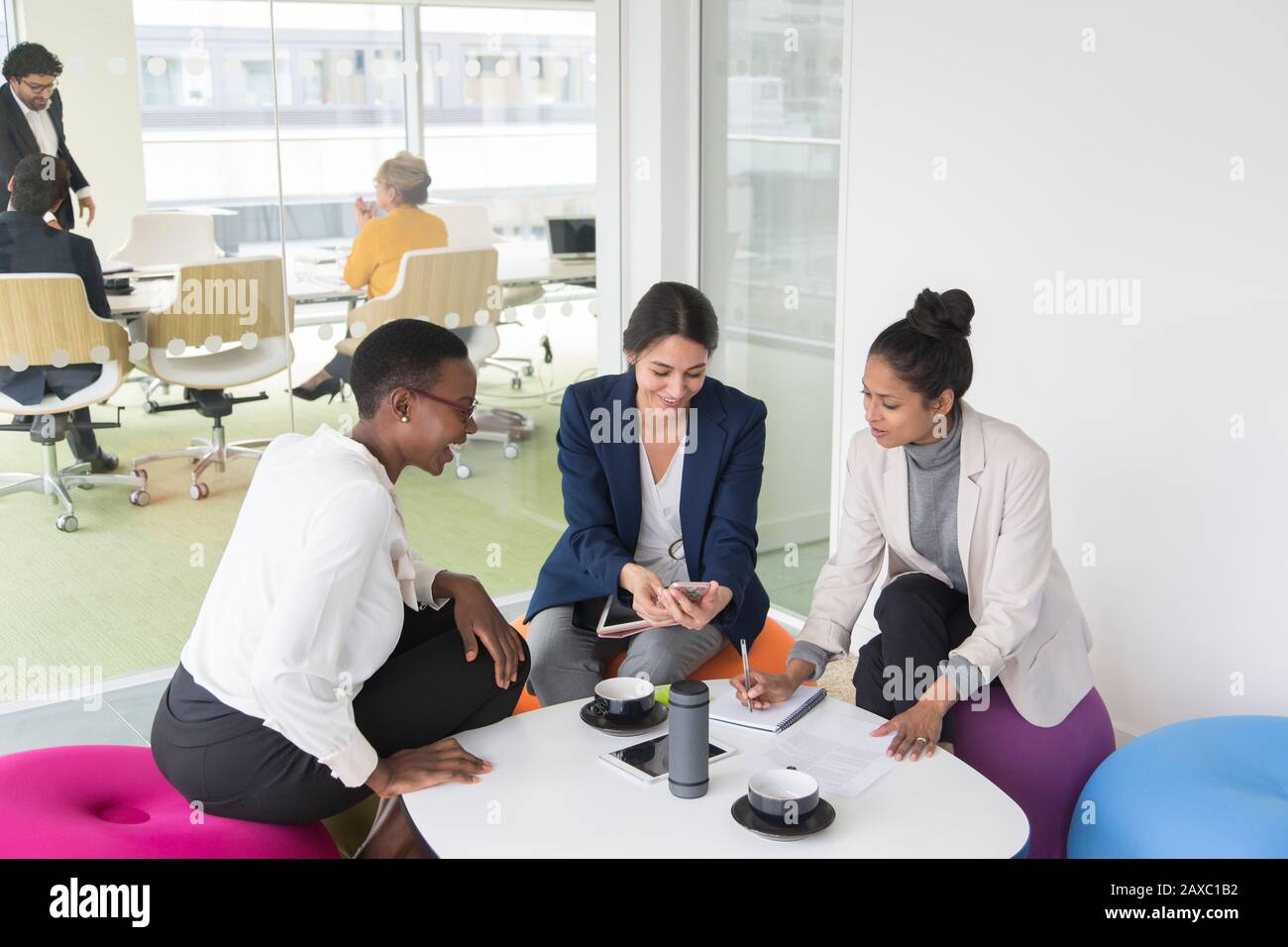 Businesswomen in conference room meeting Stock Photo - Alamy