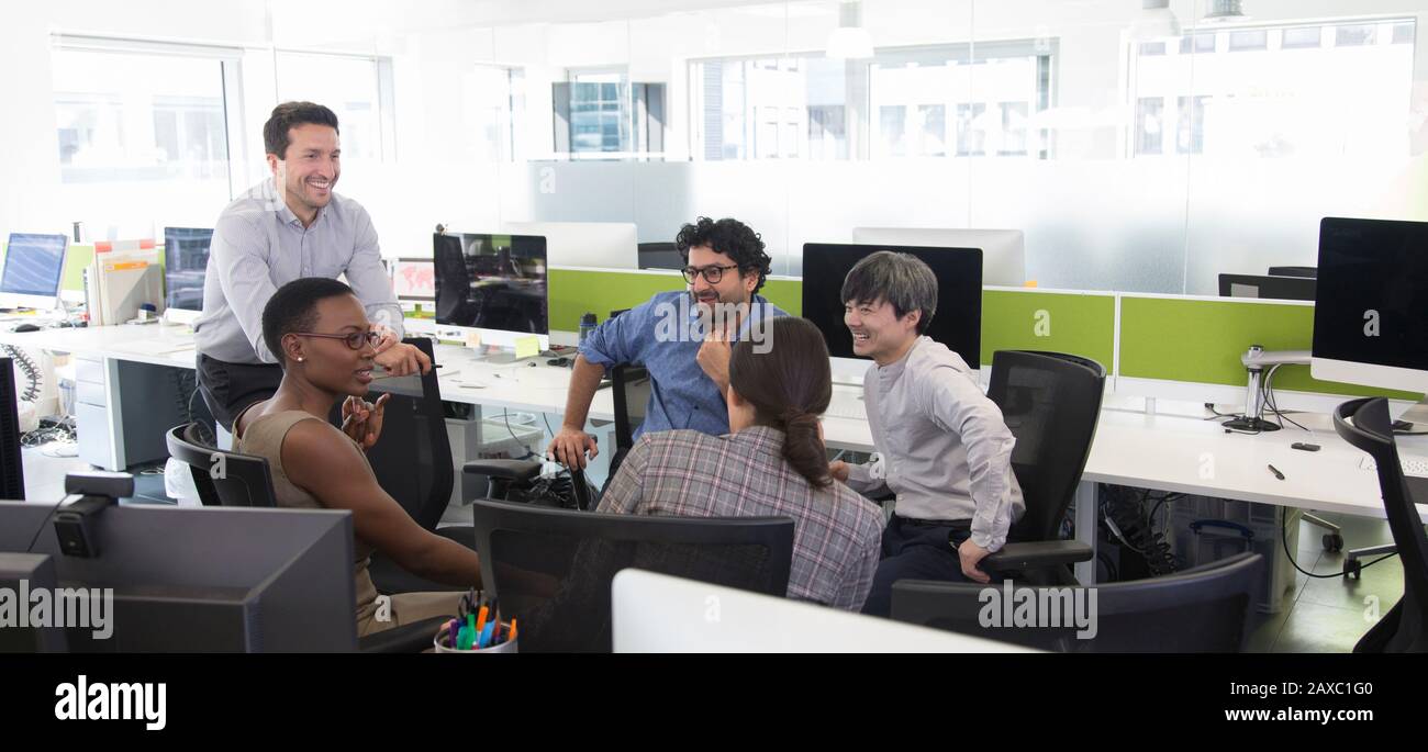 Business people meeting in open plan office Stock Photo - Alamy