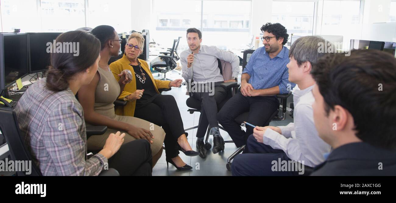 Business people talking, meeting in open plan office Stock Photo - Alamy