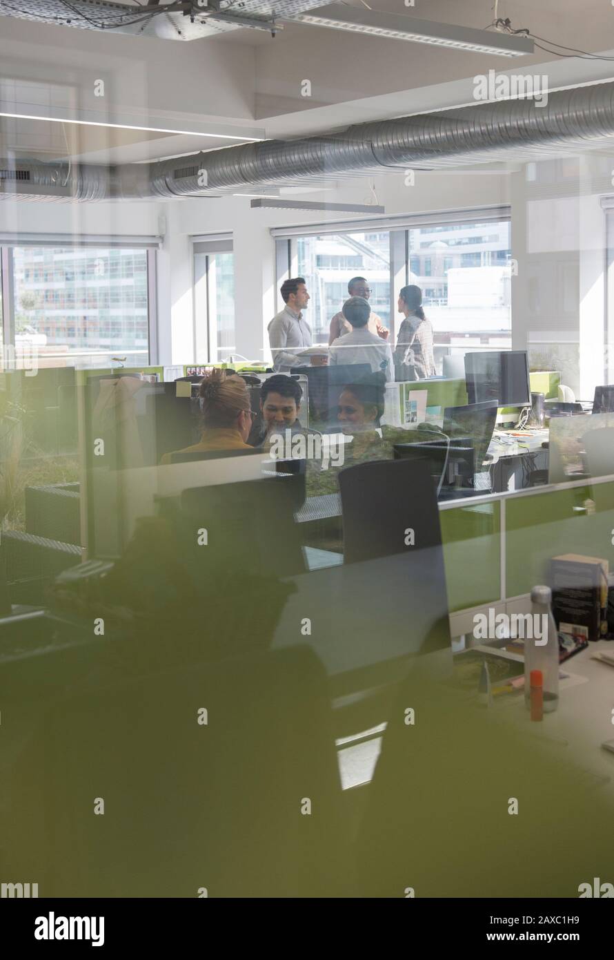 Business people working in open plan office Stock Photo - Alamy