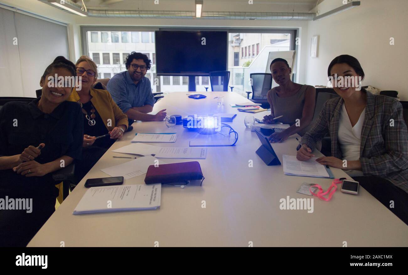 Business people watching projection presentation in conference room ...