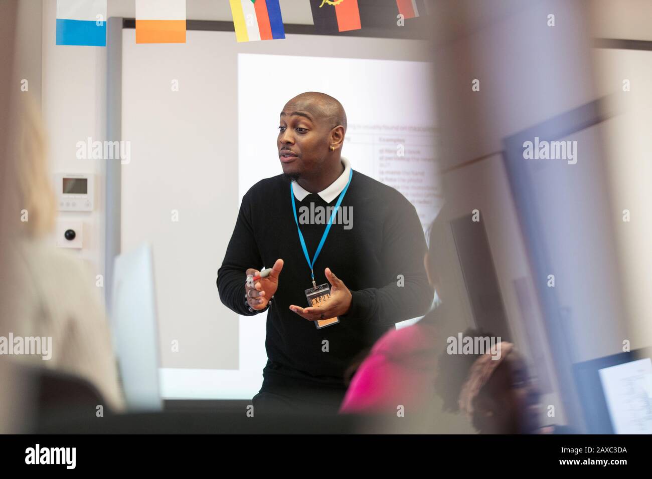 Male community college instructor leading lesson in classroom Stock ...