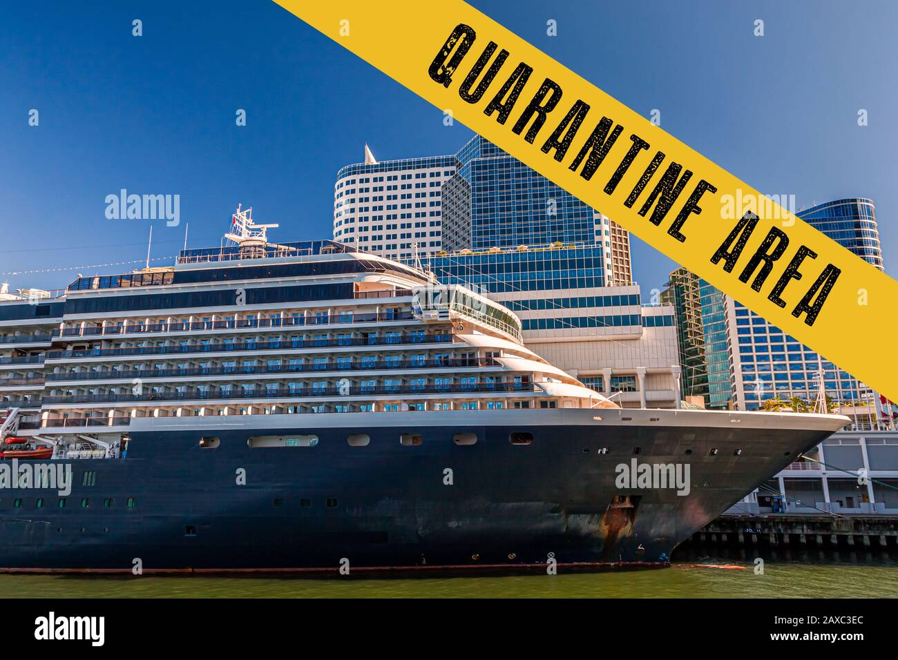 Yellow quarantine sign over a cruise ship docked at port Stock Photo ...