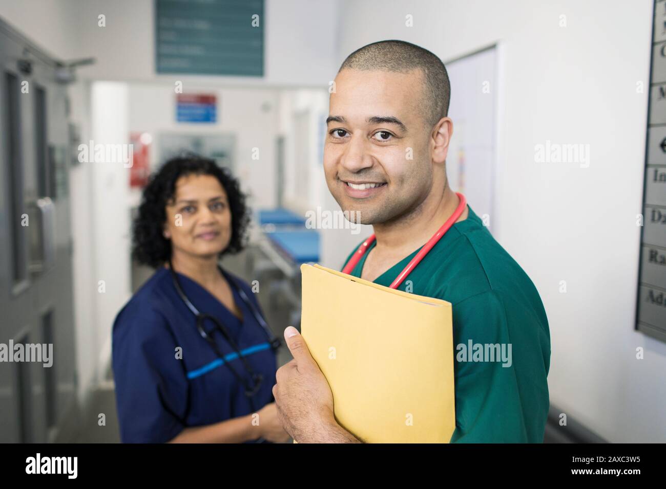 Portrait doctors in corridor hi-res stock photography and images - Alamy