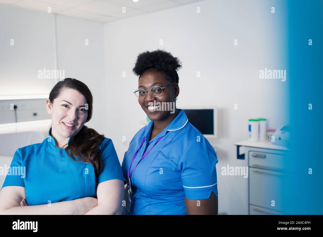 Portrait confident female nurses in hospital room Stock Photo - Alamy
