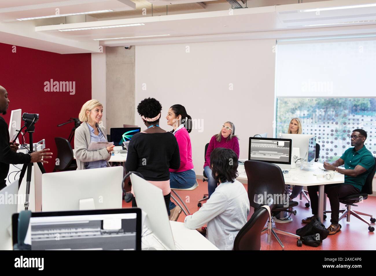 Journalism students filming in classroom Stock Photo - Alamy